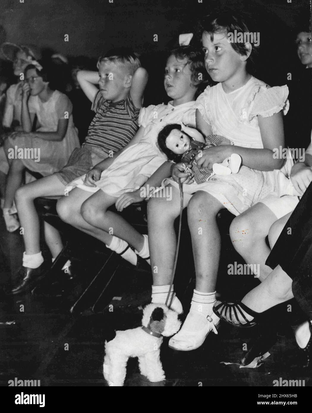 Puppet Show -- Skilful fingers guide these puppets (left) through their ...