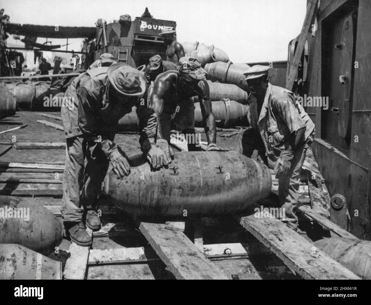 1,000 lb aerial bombs being stacked in readiness for use against the ...