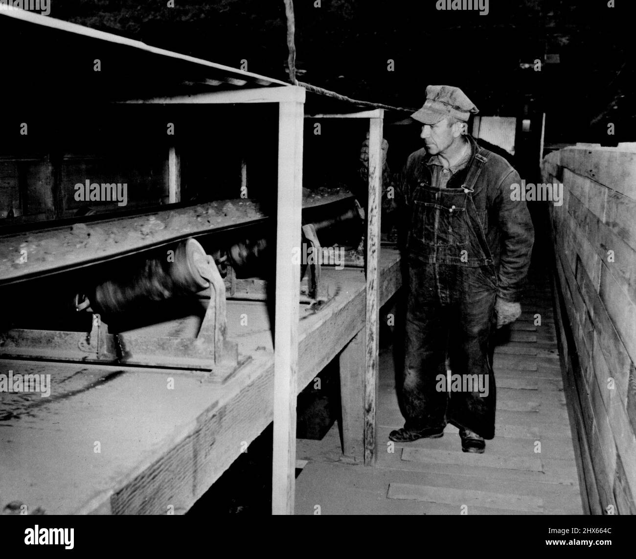 Rolling Along - A miner watches a tank in the raw roll toward the ore ...