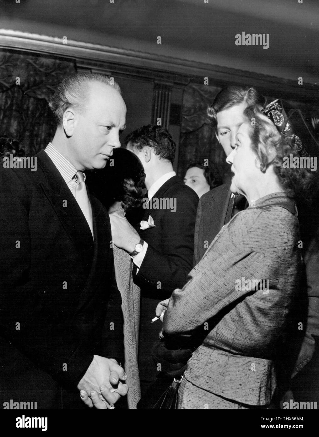 Mr. Godfrey Winn, the journalist and writer, talking to Dorothy Dixon ...