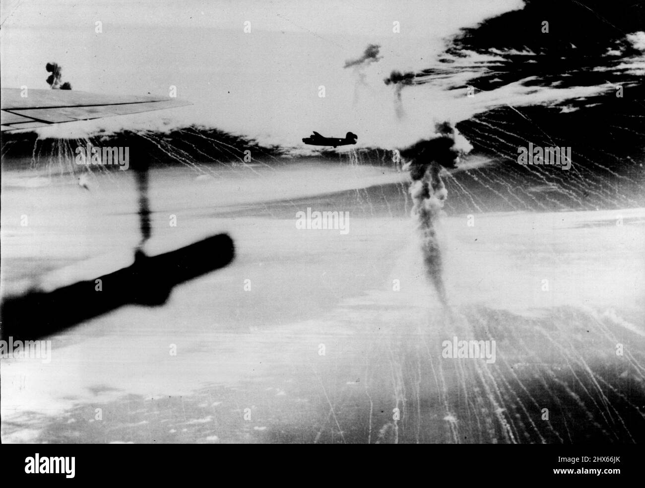 AAF Liberators Run Through Phosphorus Bombs -- Japanese installations ...