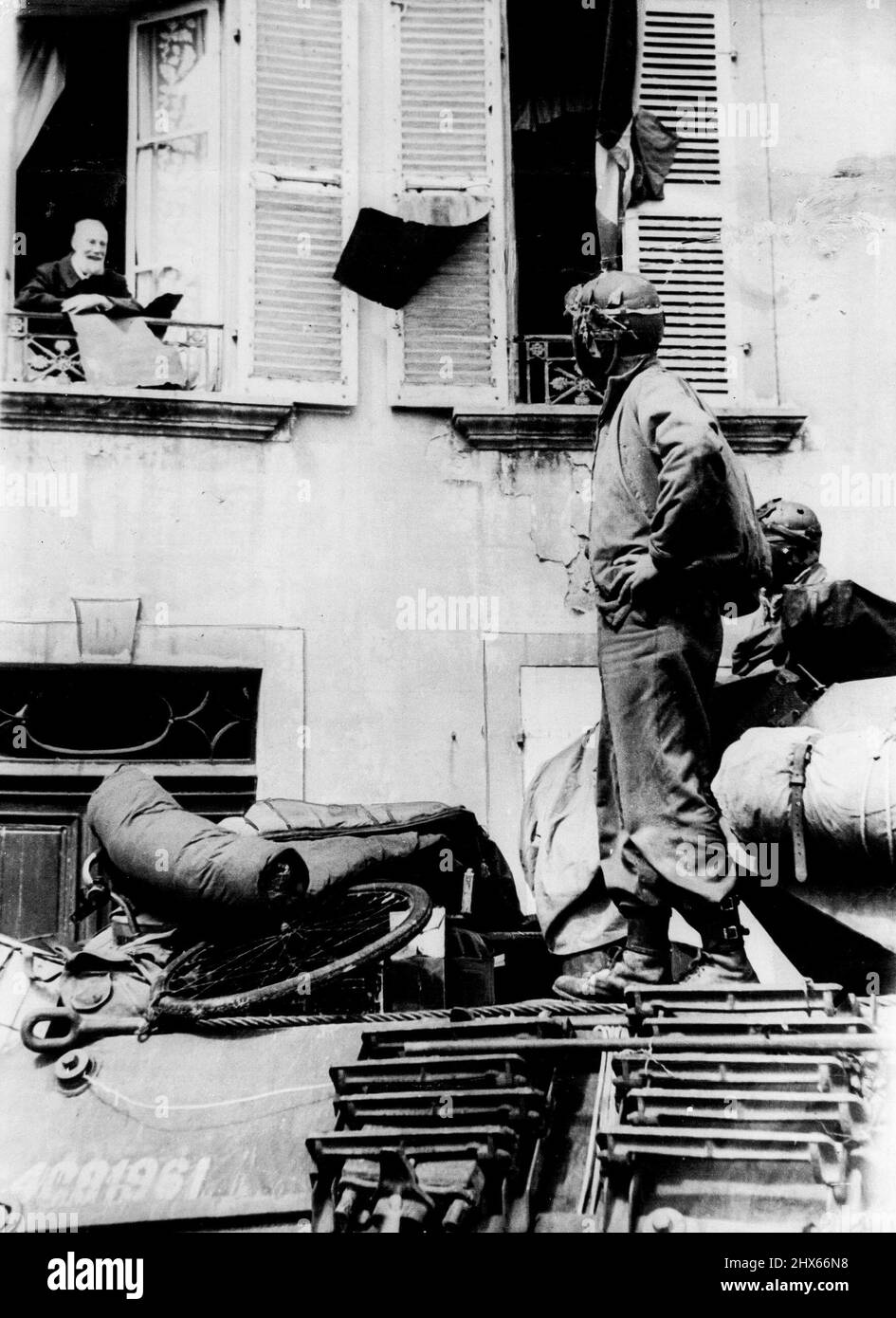 U.S. Tank Crew Receives Welcome -- An elderly Frenchman greets a U.S ...