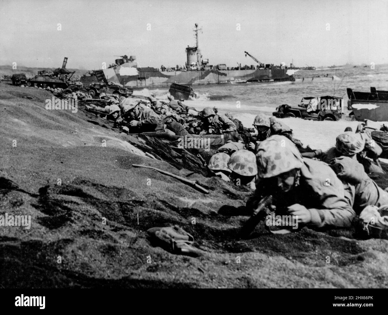 Pinned Down -- Fourth Division Marines are pinned down by enemy fire as ...