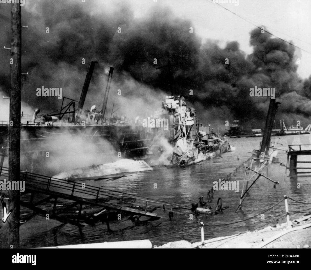 Hit by three bombs which exploded her forward magazine, the 1,500-ton ...