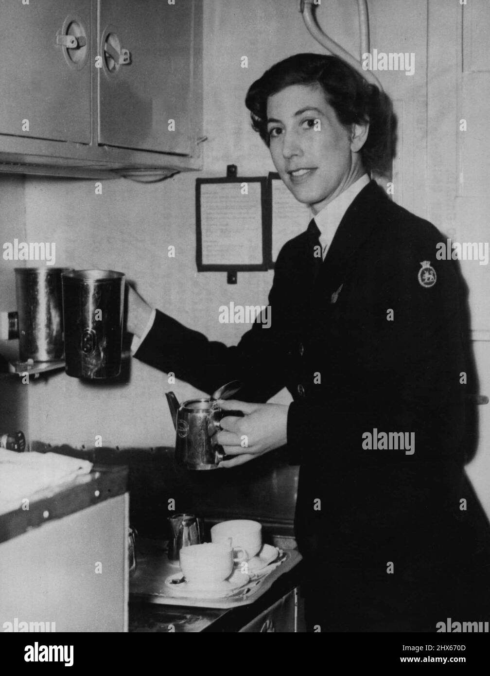 Princess's Stewardess -- Shown at work in her airborne galley is ...