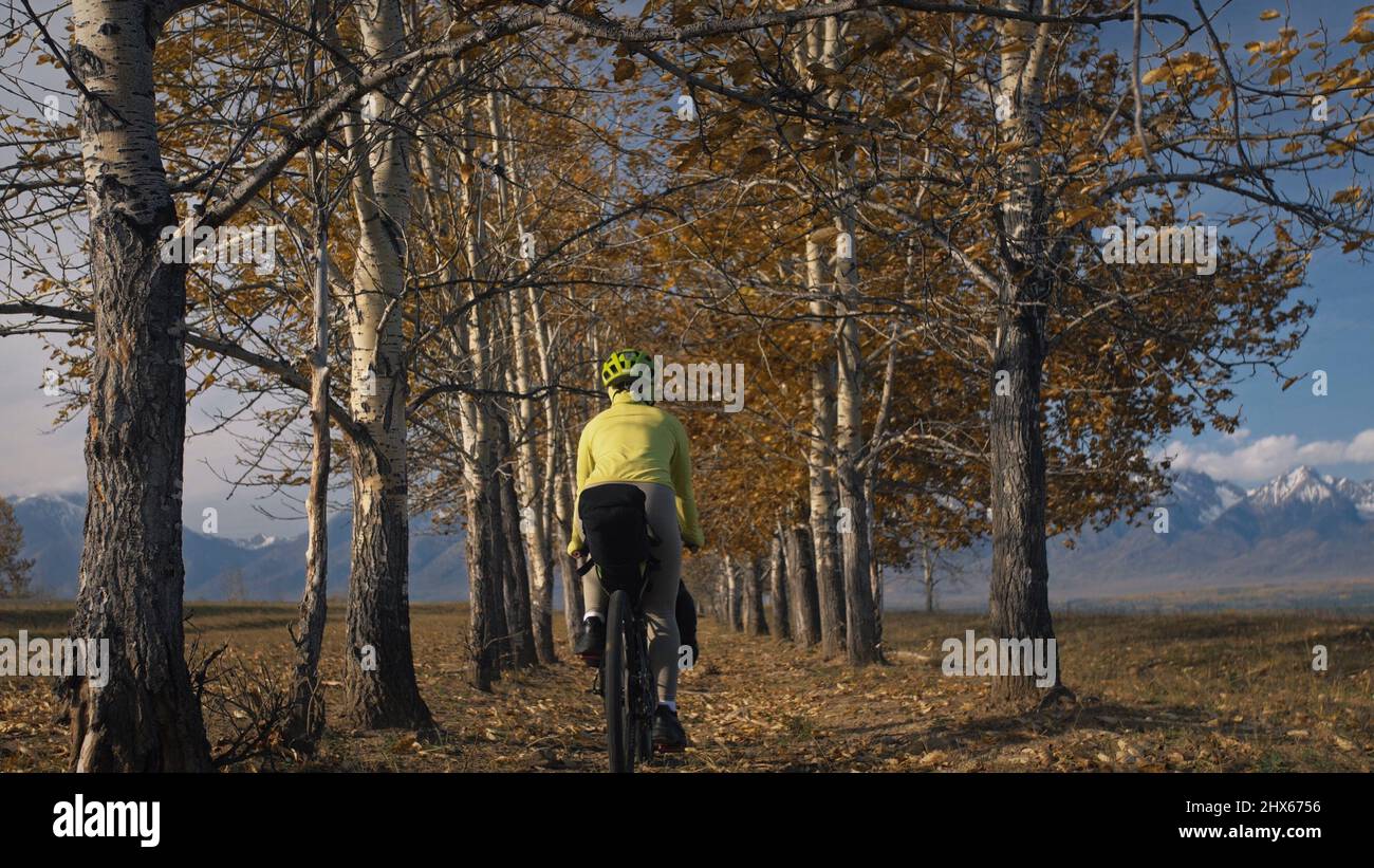 The woman travel on mixed terrain cycle touring with bikepacking. The ...