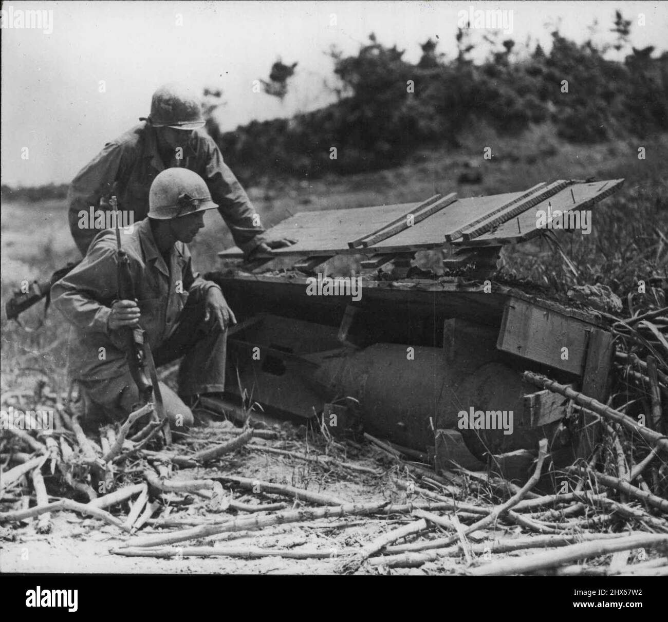 Infantrymen Examine Huge Japanese Bomb -- Infantrymen of the U.S. Tenth ...
