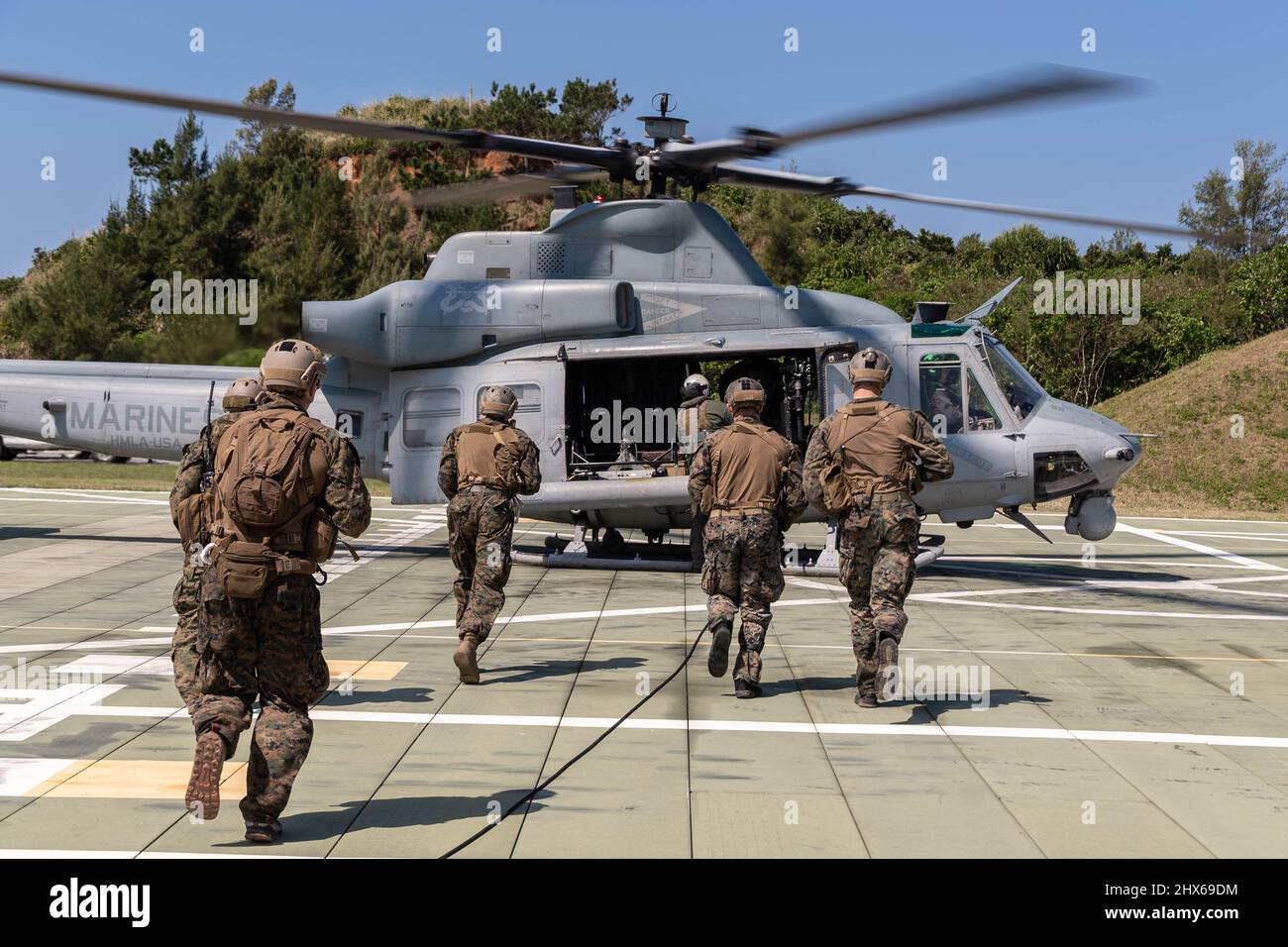 U.S. Marines with 3d Reconnaissance Battalion, 3d Marine Division, load ...