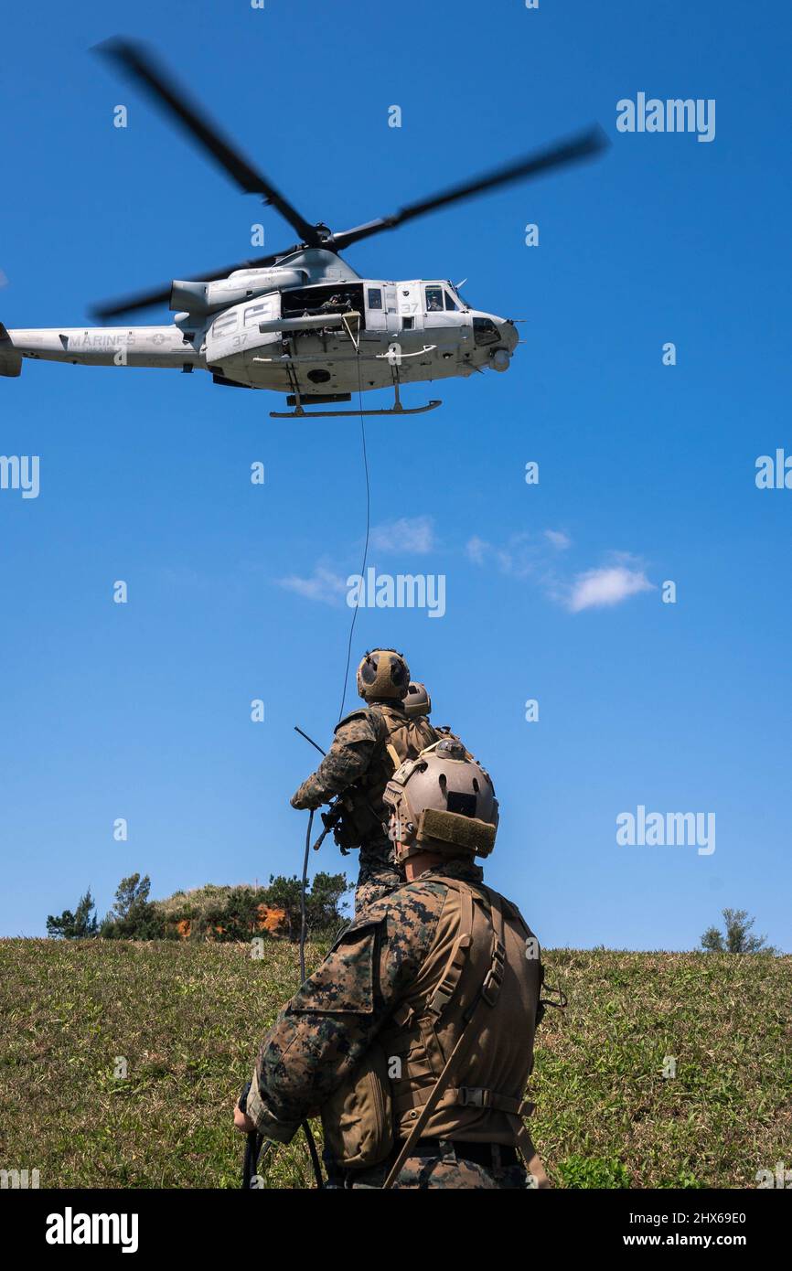 U.S. Marines with 3d Reconnaissance Battalion, 3d Marine Division, load ...