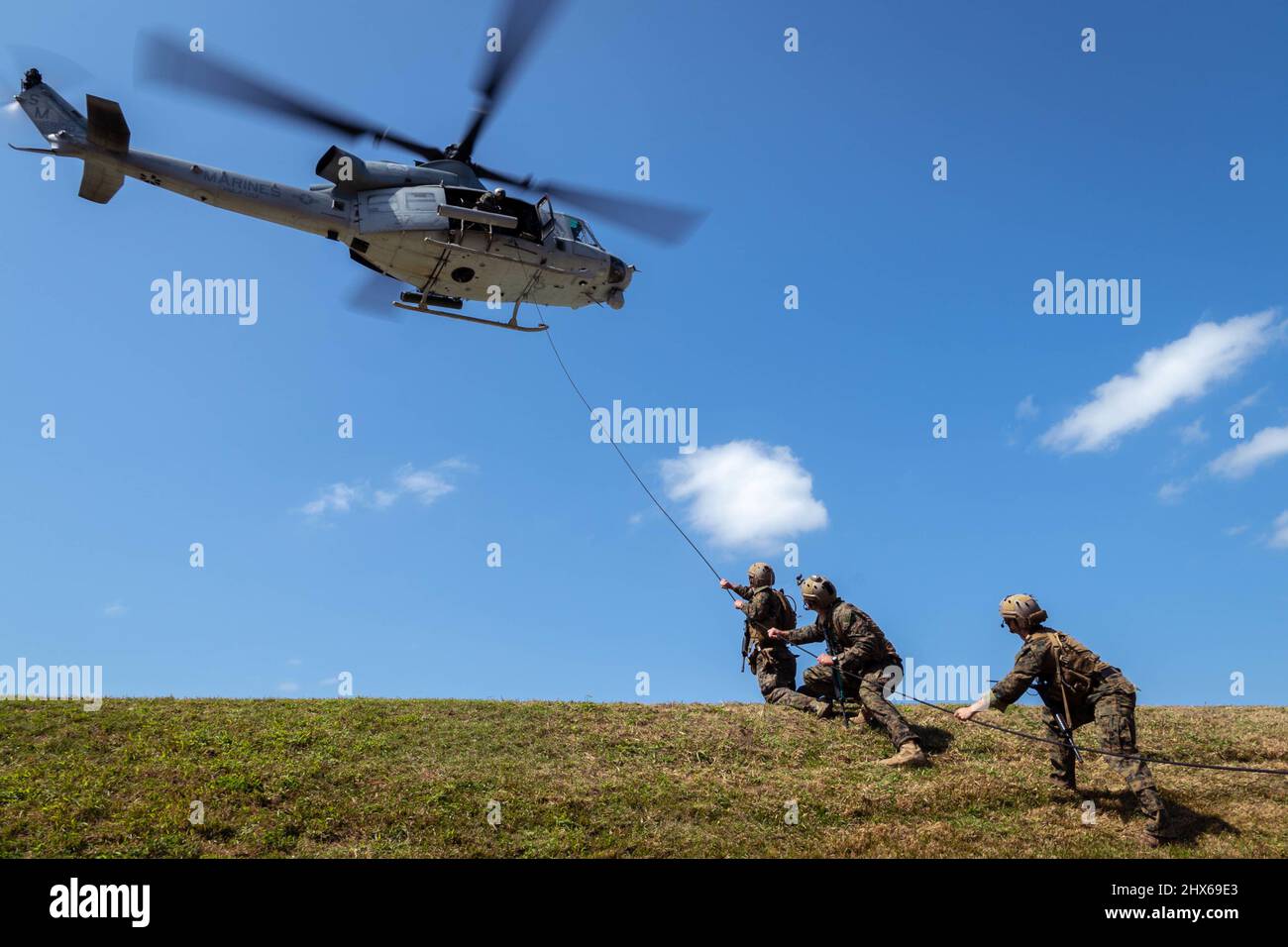 U.S. Marines with 3d Reconnaissance Battalion, 3d Marine Division, load ...