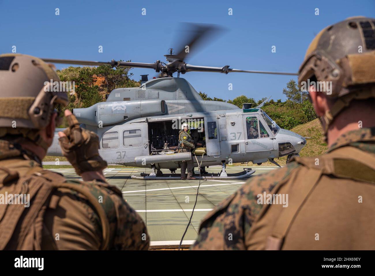U.S. Marines with 3d Reconnaissance Battalion, 3d Marine Division, load ...