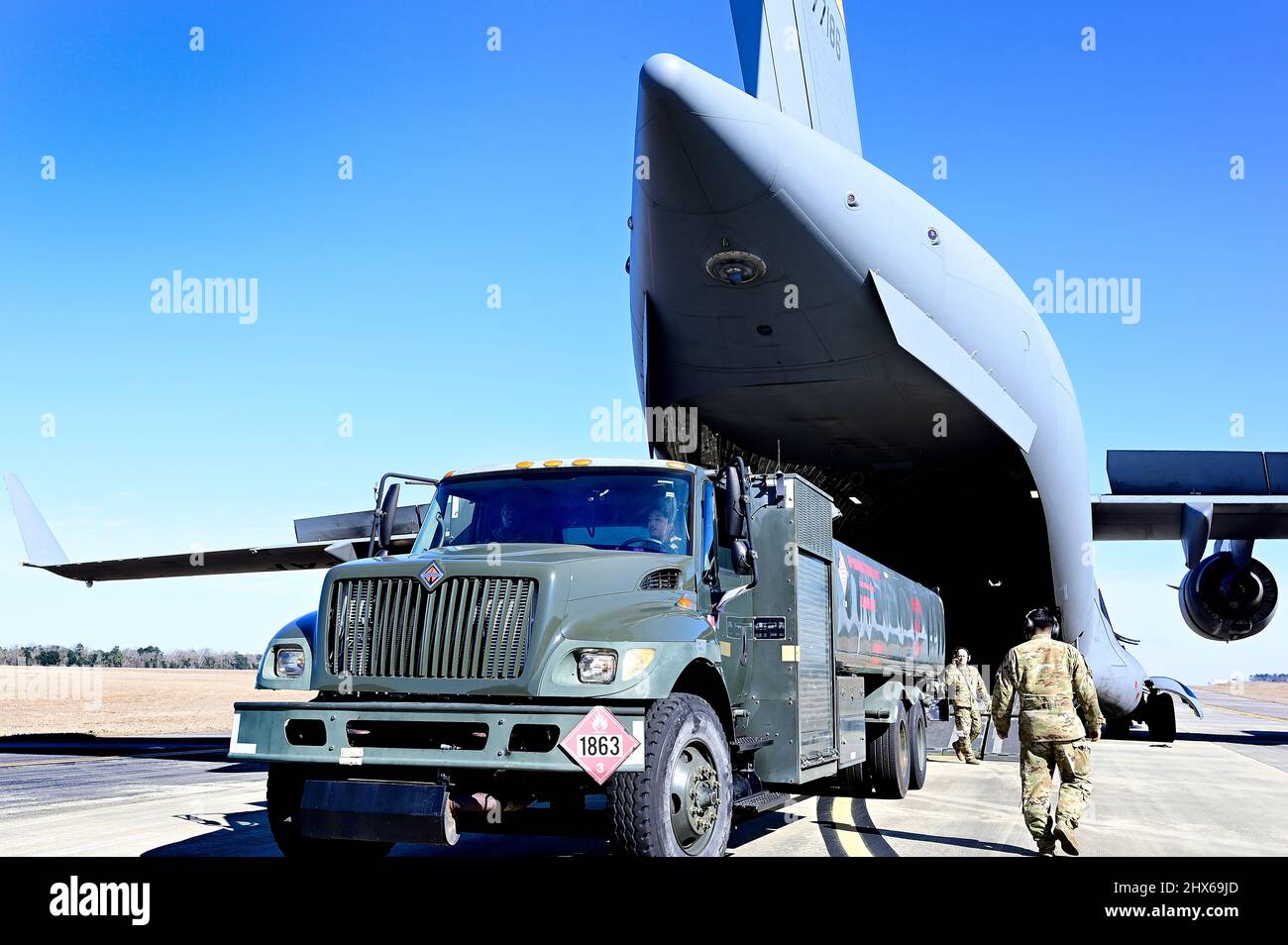 U.S. Air Force loadmasters assigned to the 16th Airlift Squadron unload ...
