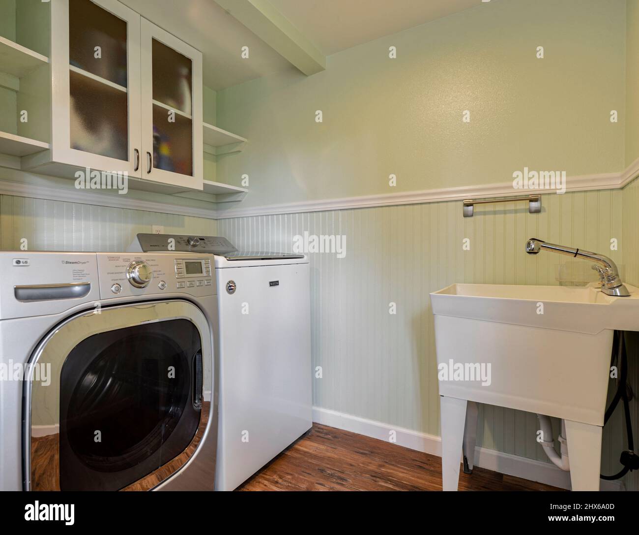 Modern residential laundry room interior Stock Photo - Alamy