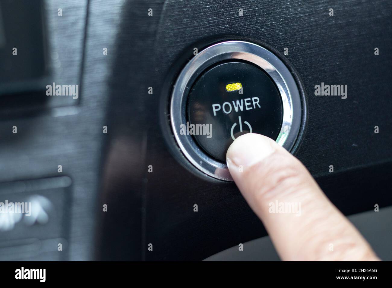 finger on a power button to push start the car engine Stock Photo - Alamy