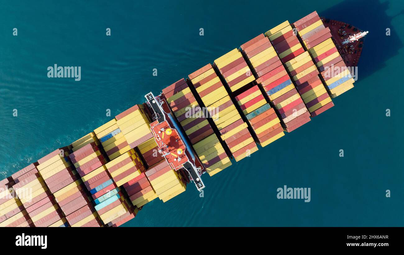 Aerial top view of cargo ship carrying container and running for export ...