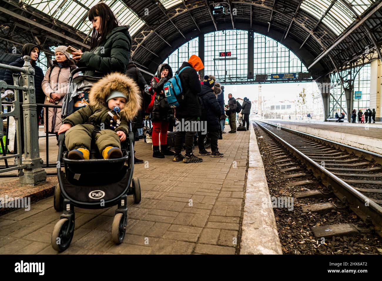 A child in a stroller seen on the train platform in Lviv. As Russia ...