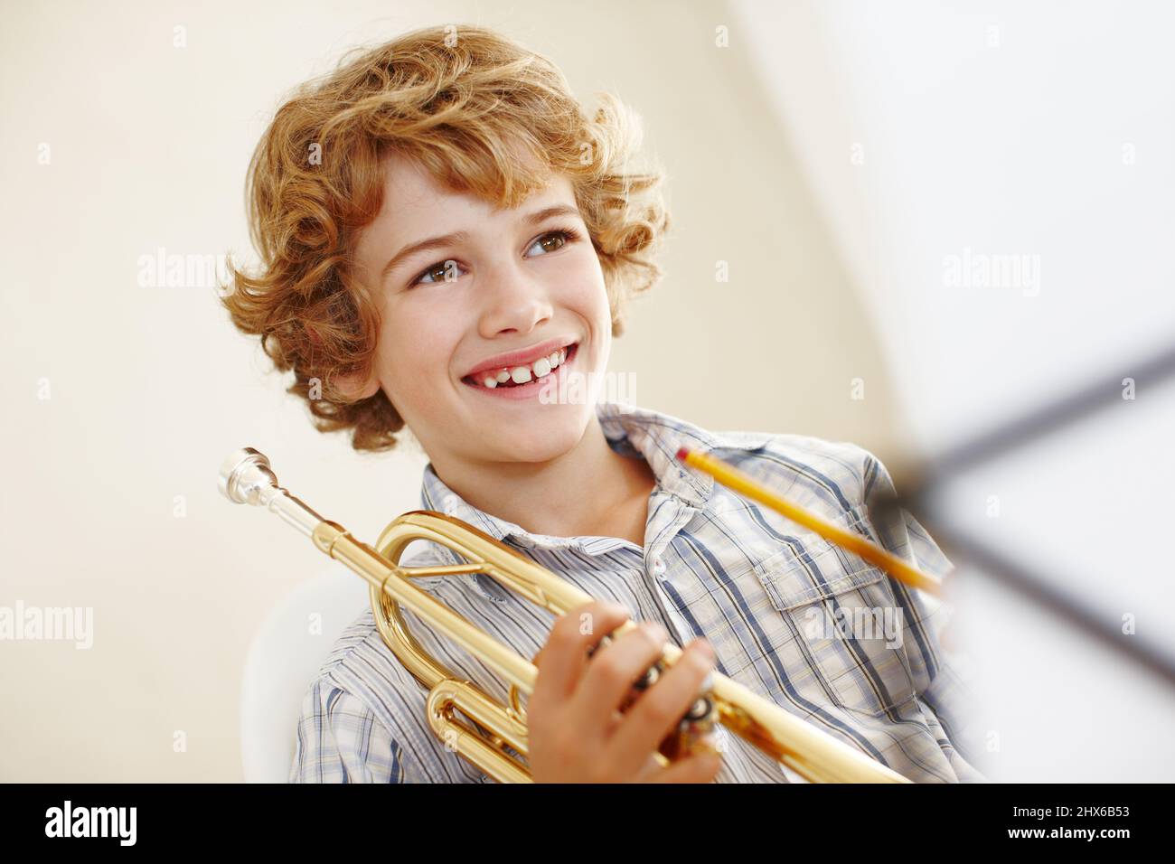 Following his musical dream. Shot of a cute little boy playing the ...