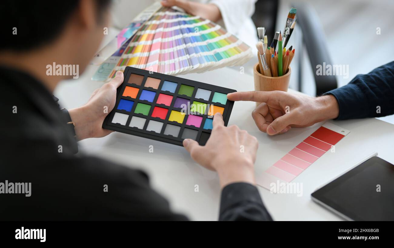 Close-up image, the graphic design team is discussing and sharing ...