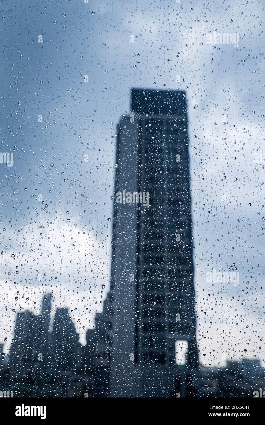 Abstract image of Rain drops on the dirty glass windows with modern ...