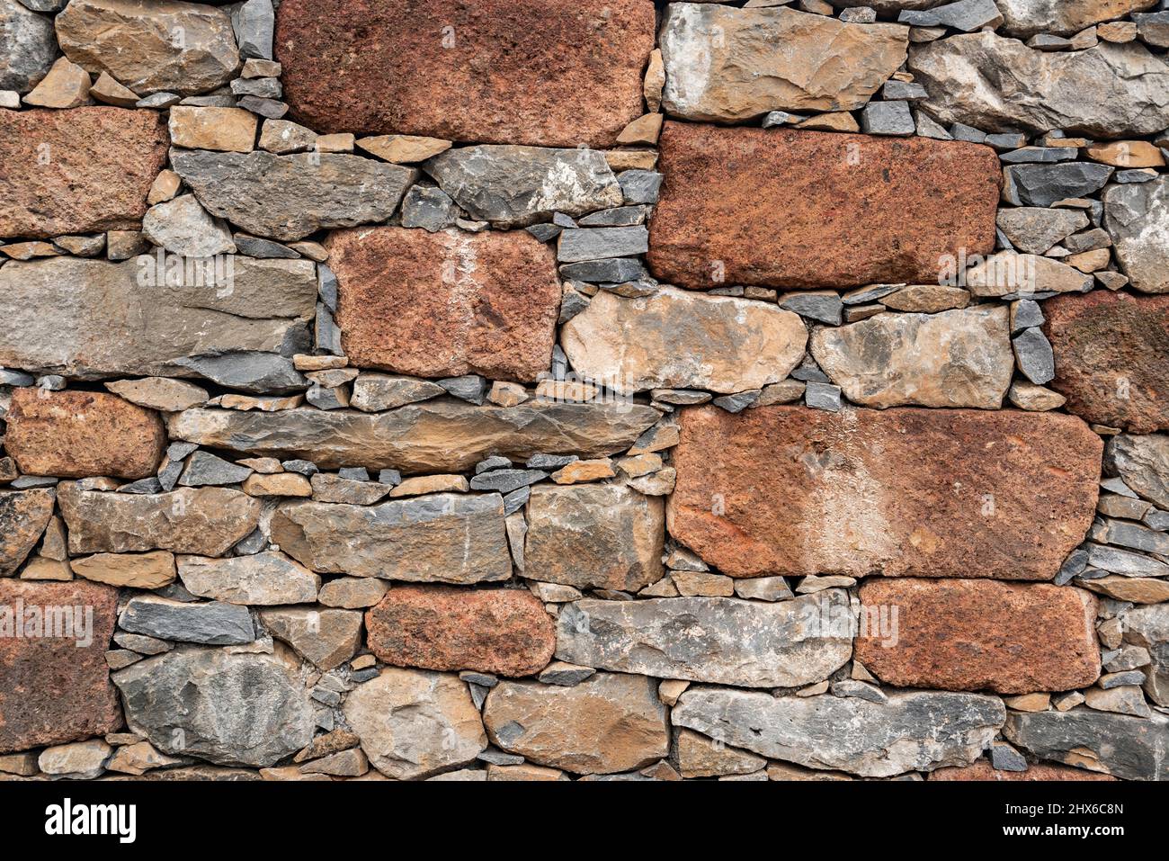 Natural stone wall background texture, showing a accurately brick-built ...