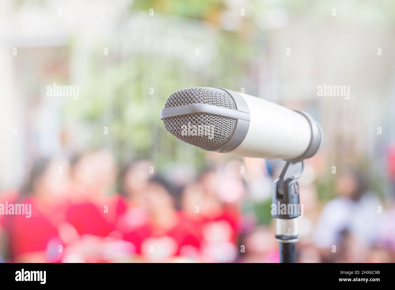 Close up of microphone in public place with blur background Stock Photo ...