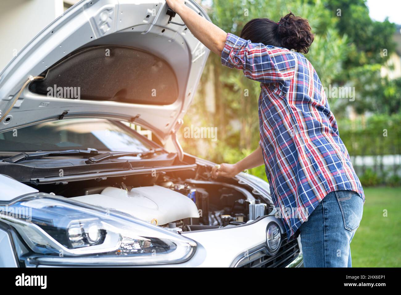 Open hood mechanic engine system to check and repair damage car crash ...