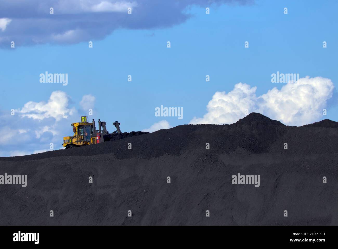 Bulldozer pushing coal at Boonal Coal Loading Central Queensland ...