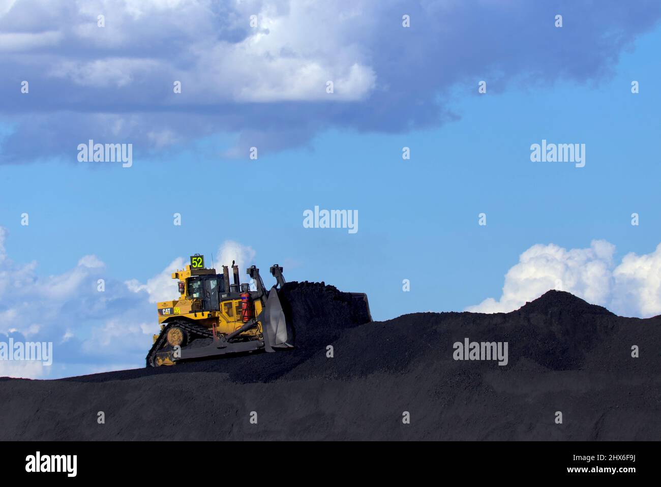 Bulldozer pushing coal at Boonal Coal Loading Central Queensland ...