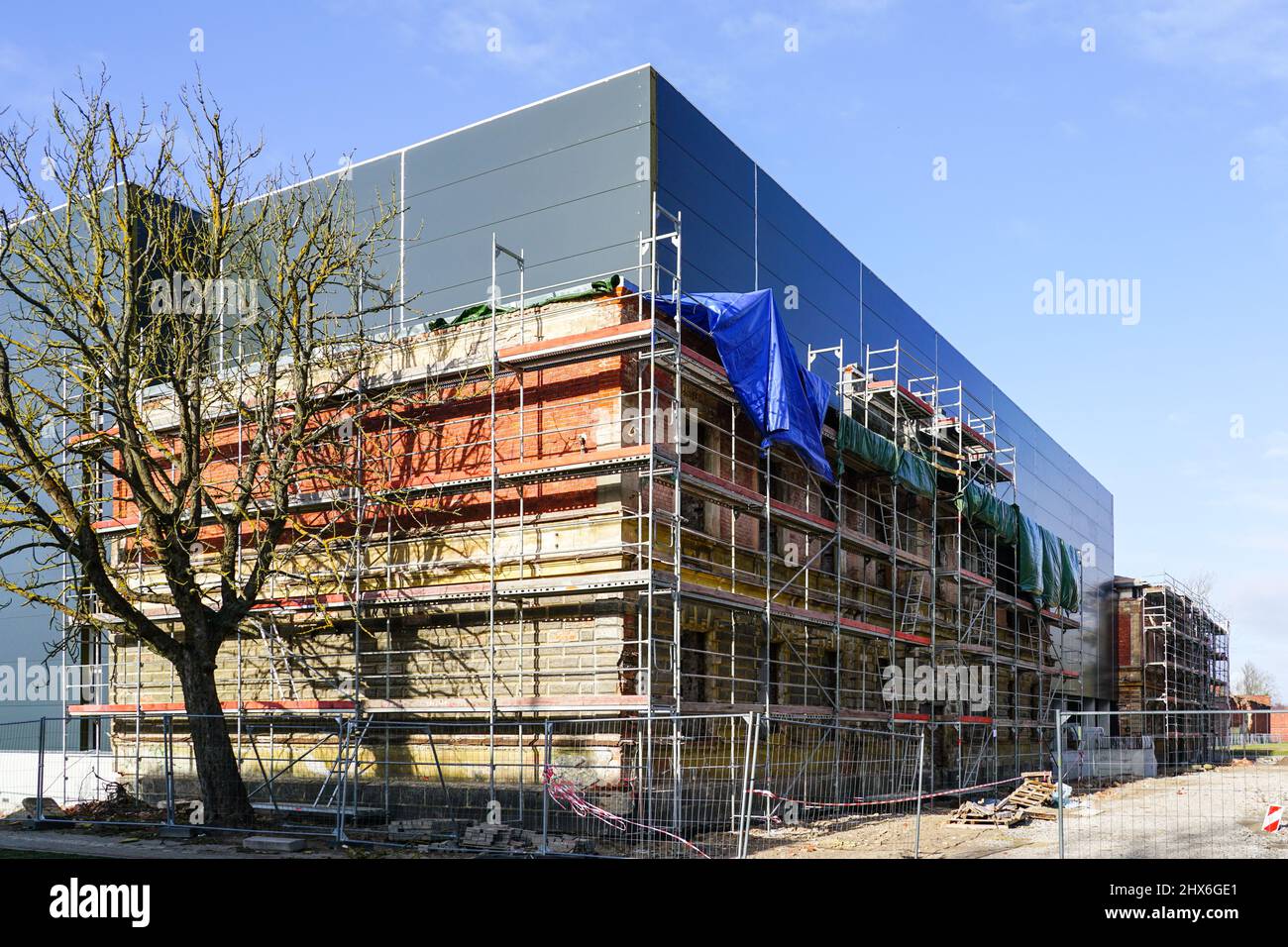 a combination of the facade of an old historical brick house with a new ...