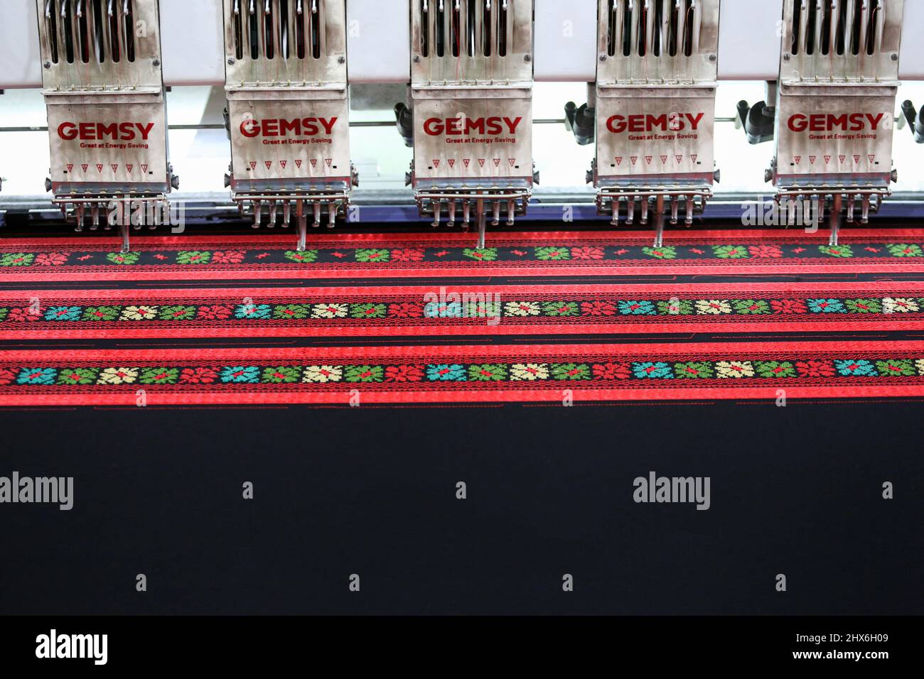 Palestinian heritage dress seen in an embroidery machine in a sewing ...