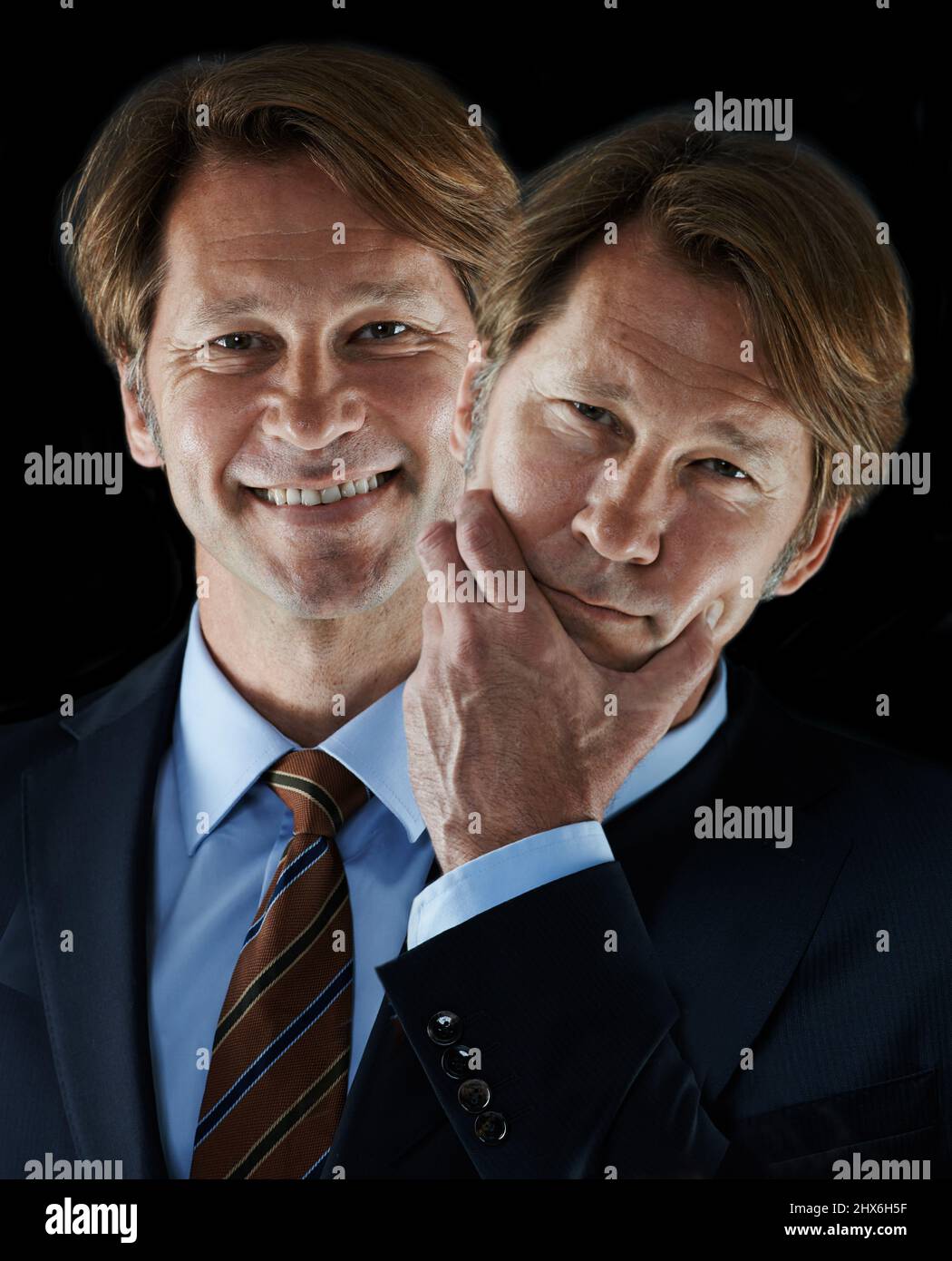 Im in two minds about this. Concept shot of a businessman showing ...