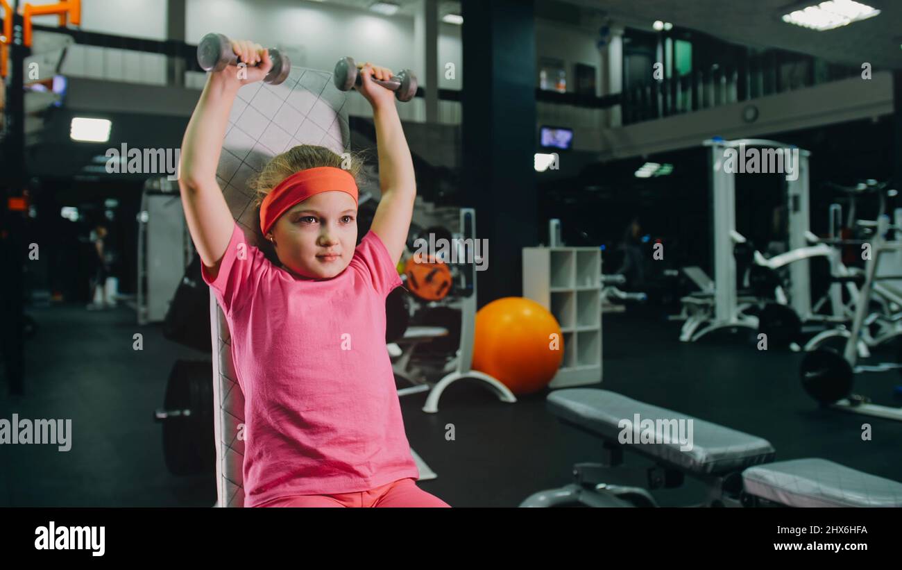 Fit Athletic Baby Girl Work out with Dumbbell, Doing Her Fitness ...