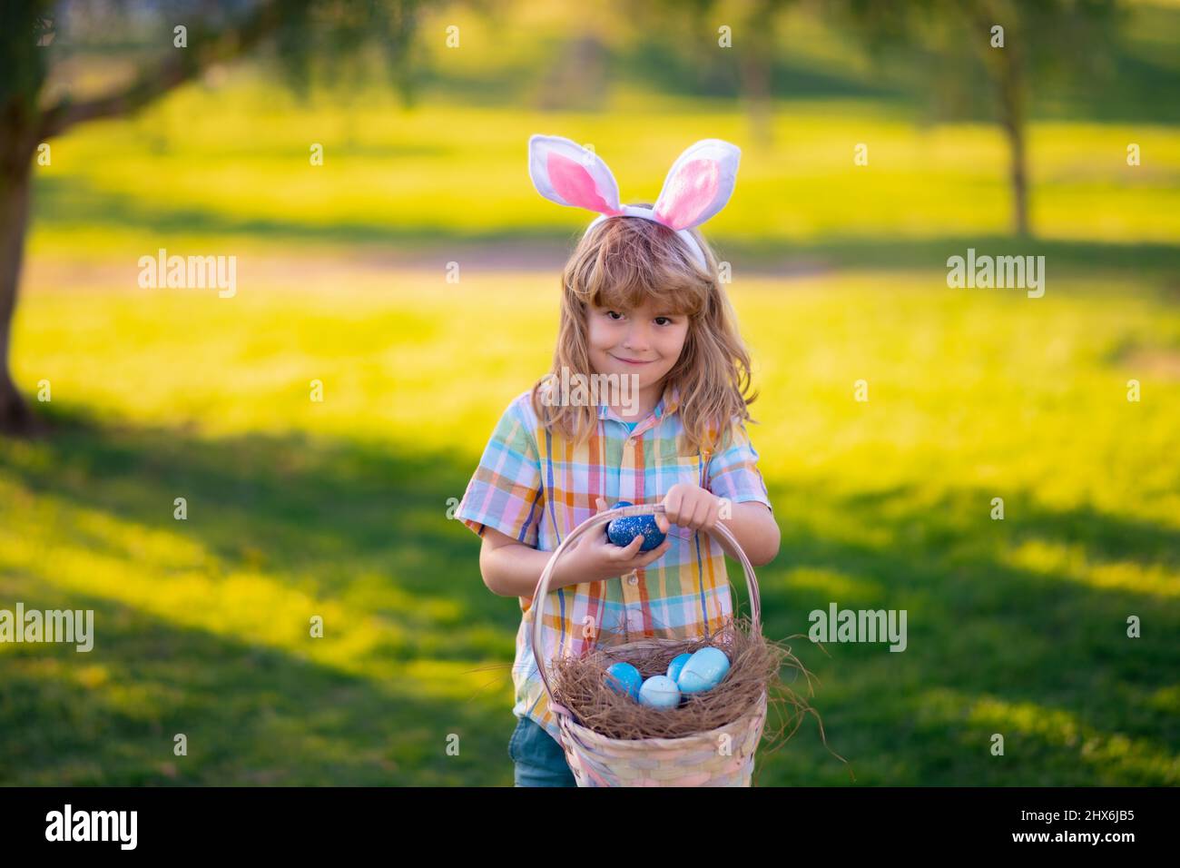 Happy Easter for children. Child boy hunting easter eggs. Cute kid in ...