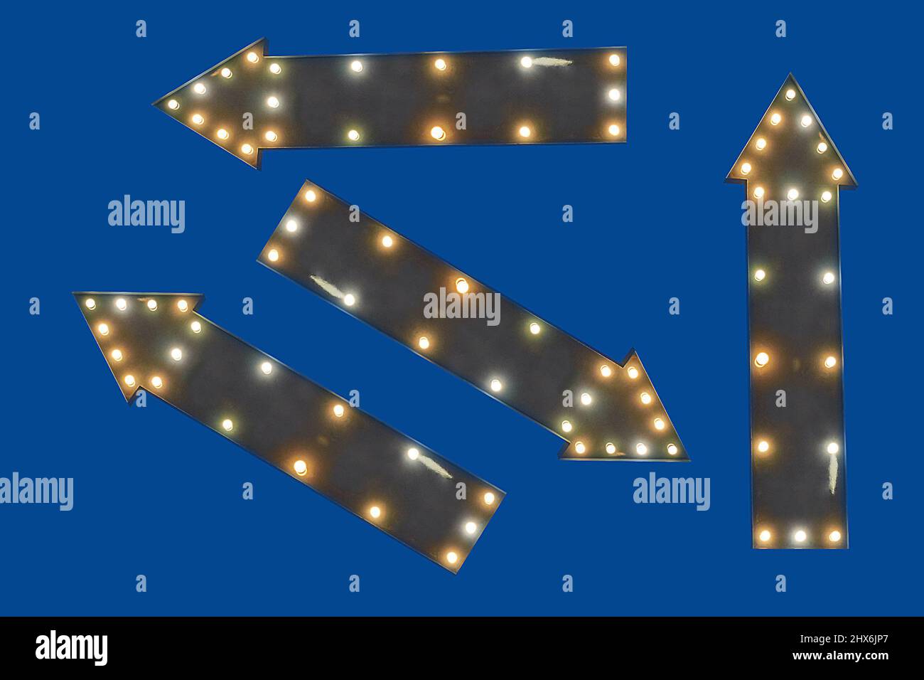 Four dark gray arrows with light bulbs on a blue background, pointers ...