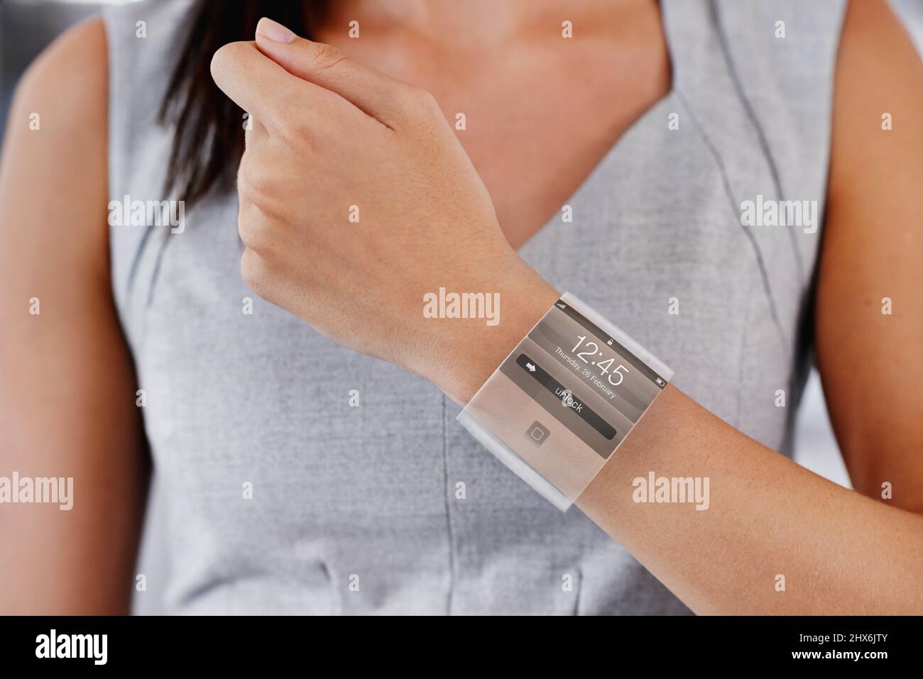 Keeping up with technology. Closeup studio shot of a businesswomans arm ...