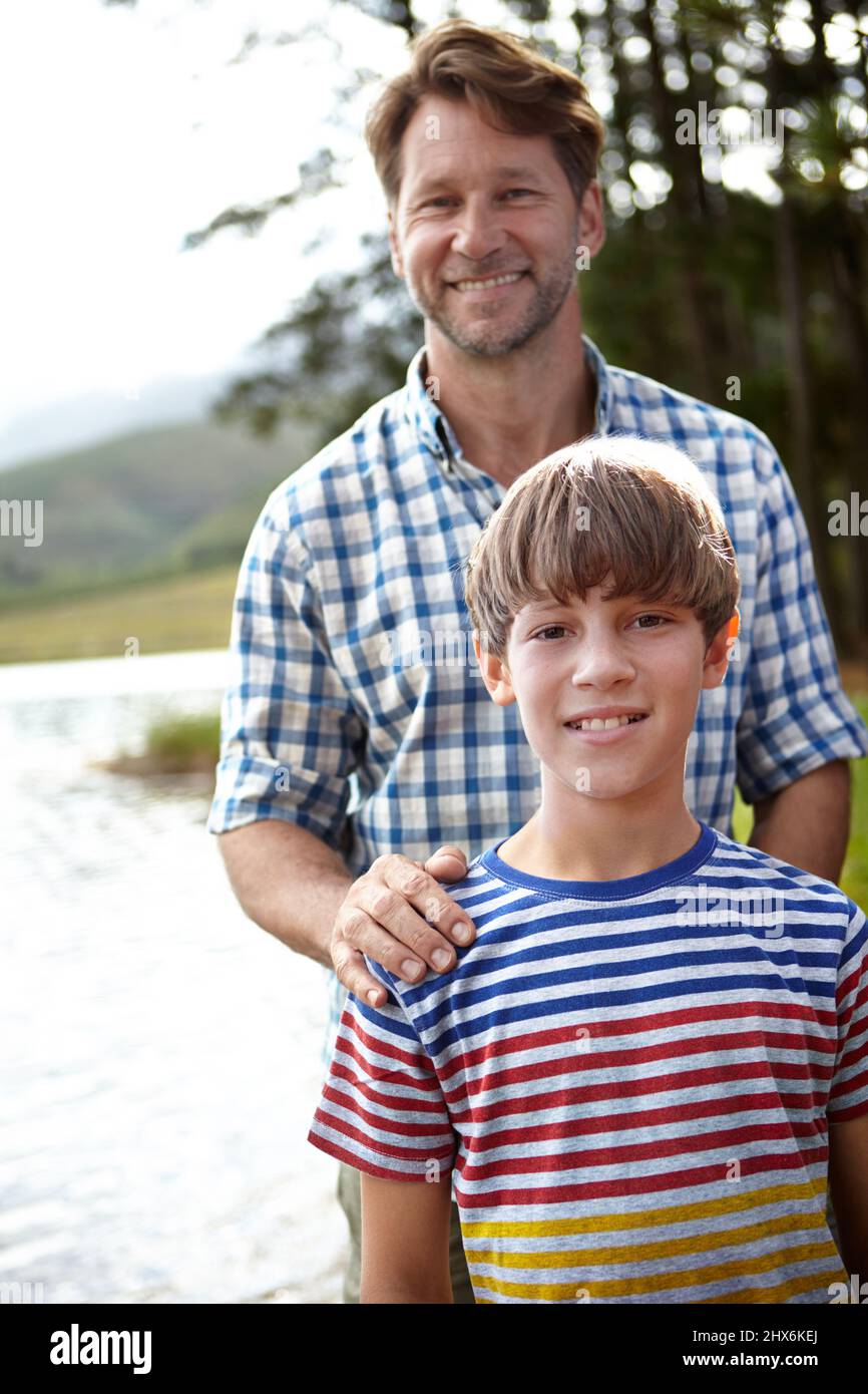 So proud of my son. Portrait of a proud father and his son standing ...