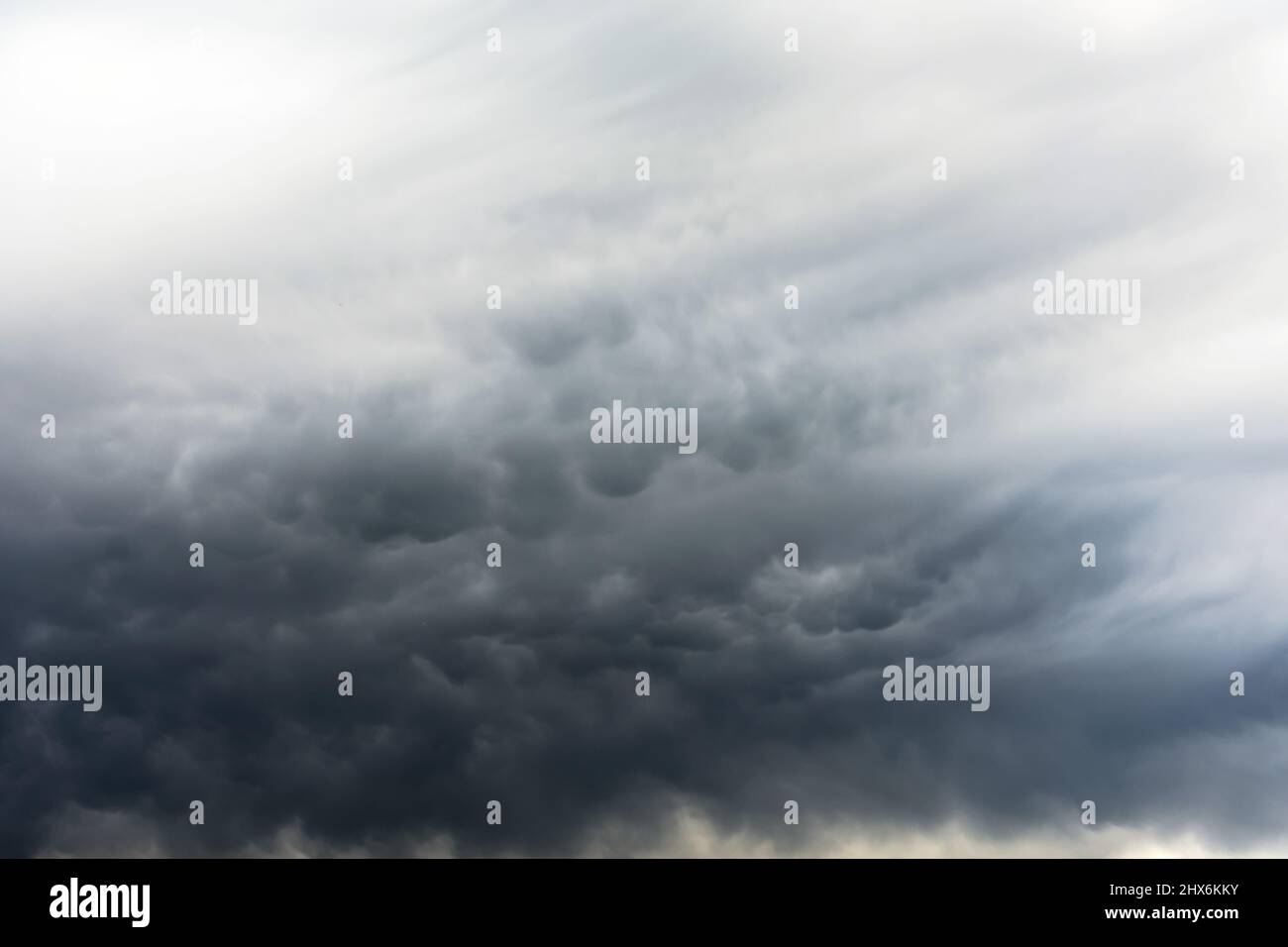 Mammatus clouds fill the sky after a passing supercell thunderstorm ...
