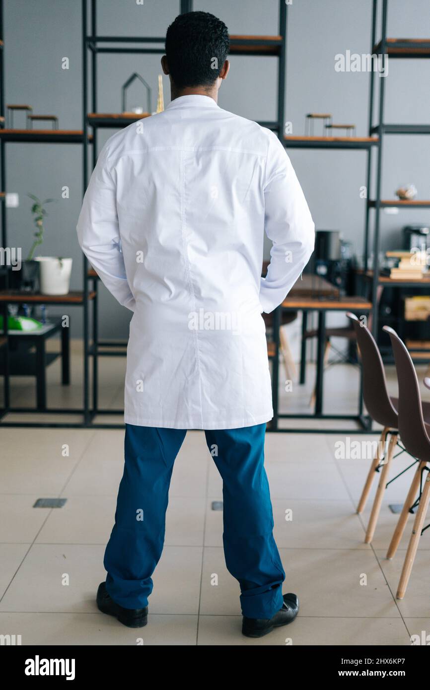 Back view of unrecognizable African American male doctor wearing ...