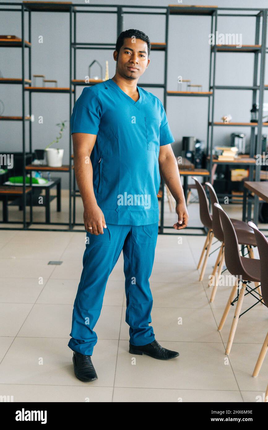 Vertical portrait of confident African American male doctor wearing ...