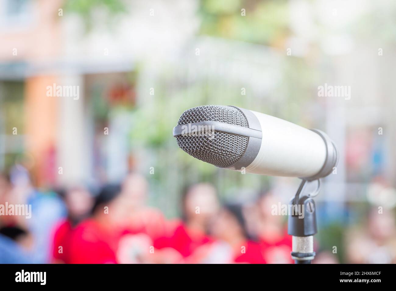 Close up of microphone in public place with blur background Stock Photo ...