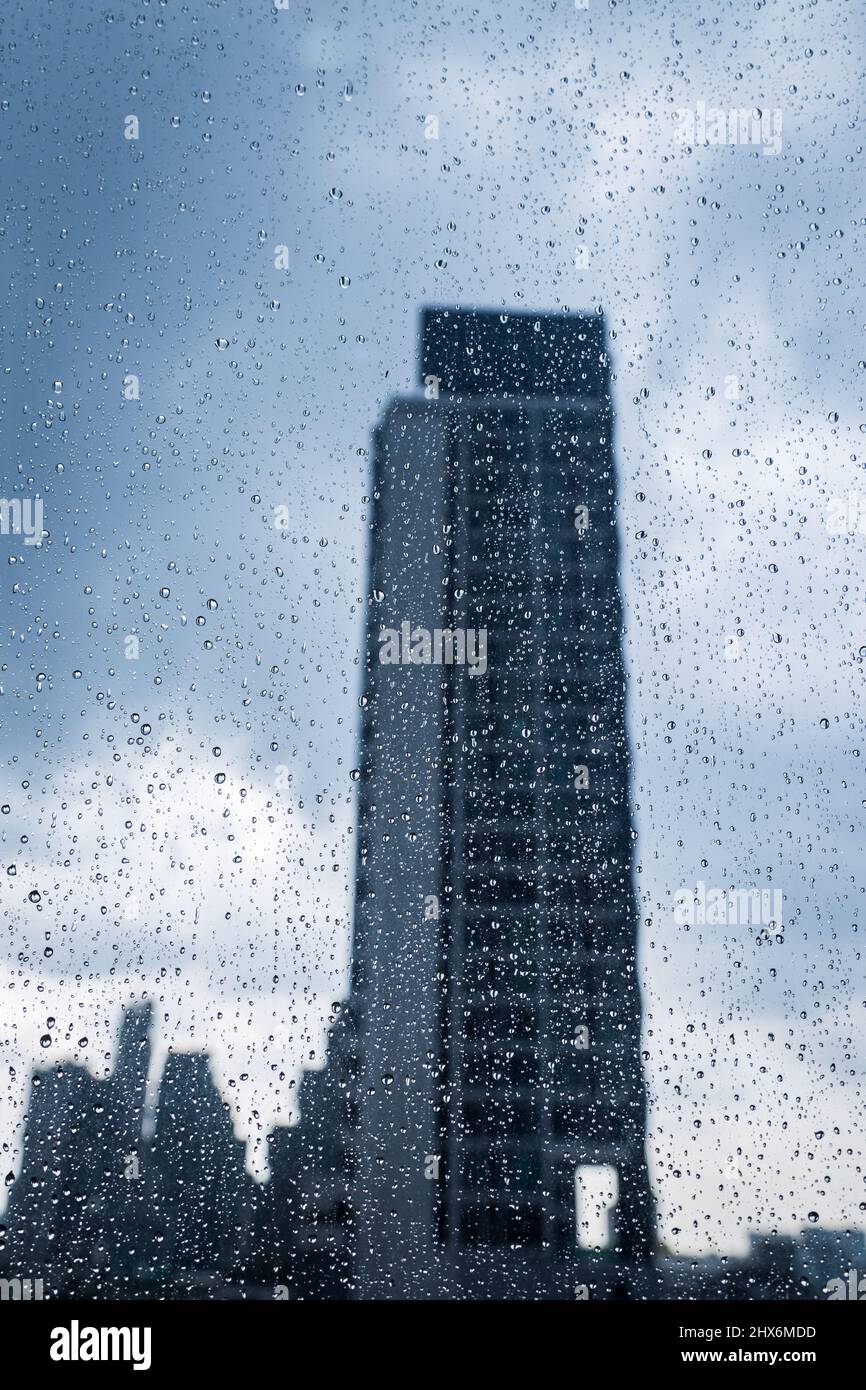 Abstract image of Rain drops on the dirty glass windows with modern ...