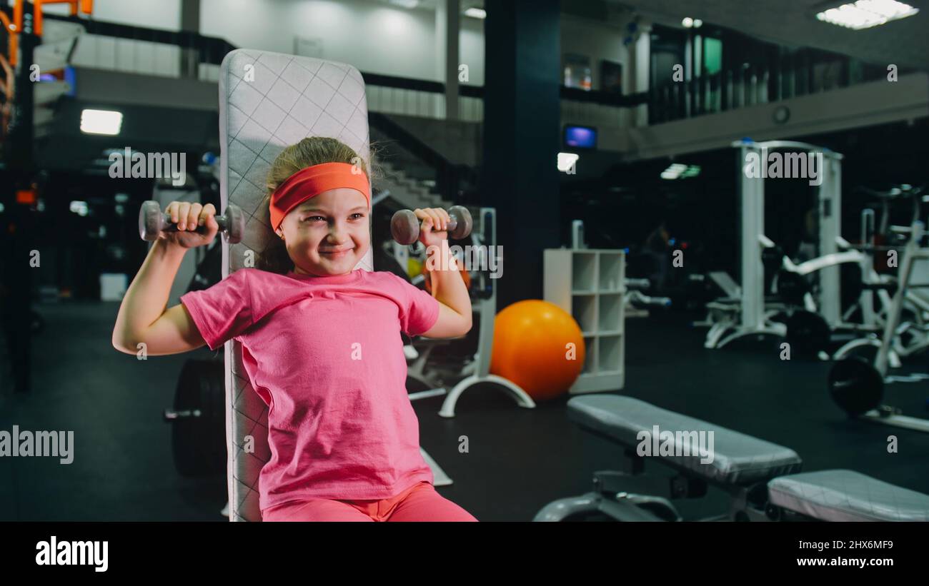 Fit Athletic Baby Girl Work out with Dumbbell, Doing Her Fitness ...