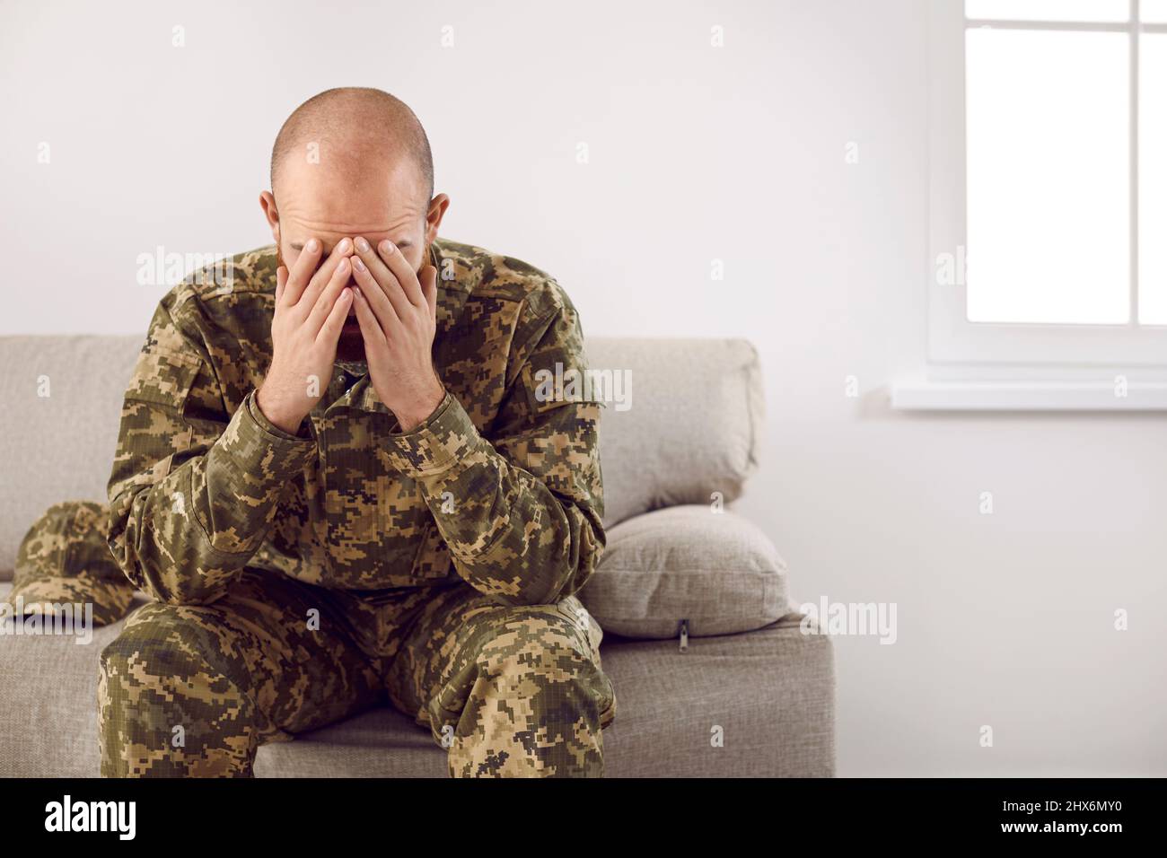 Unhappy soldier in uniform feel stressed and pensive Stock Photo - Alamy