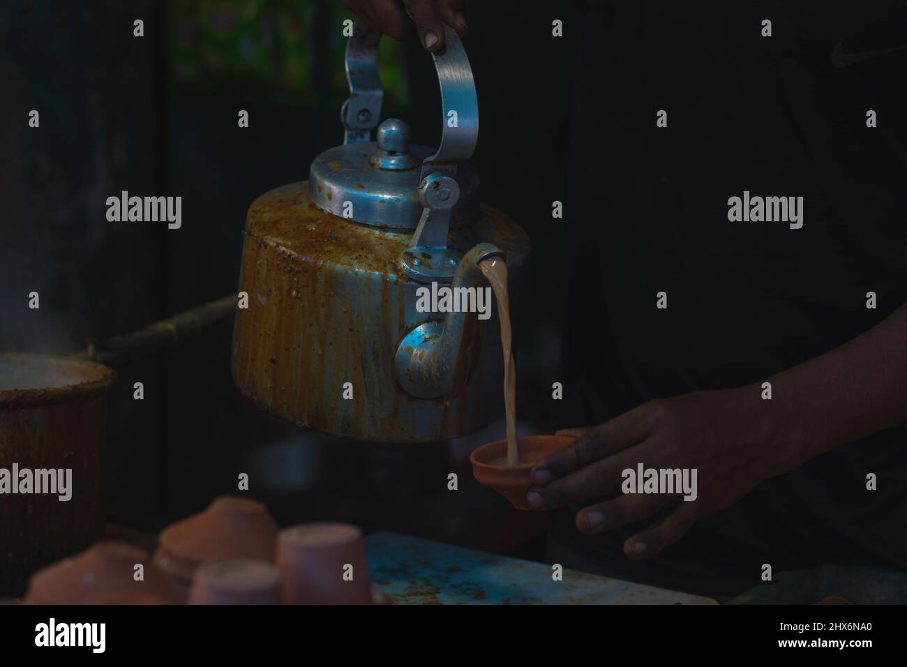 Indian traditionally tea making process in a road side tea stall Stock ...