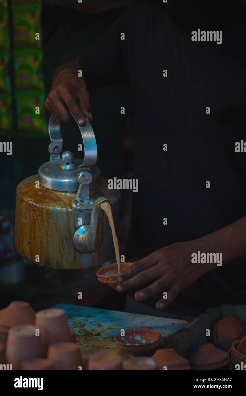 Indian traditionally tea making process in a road side tea stall Stock ...