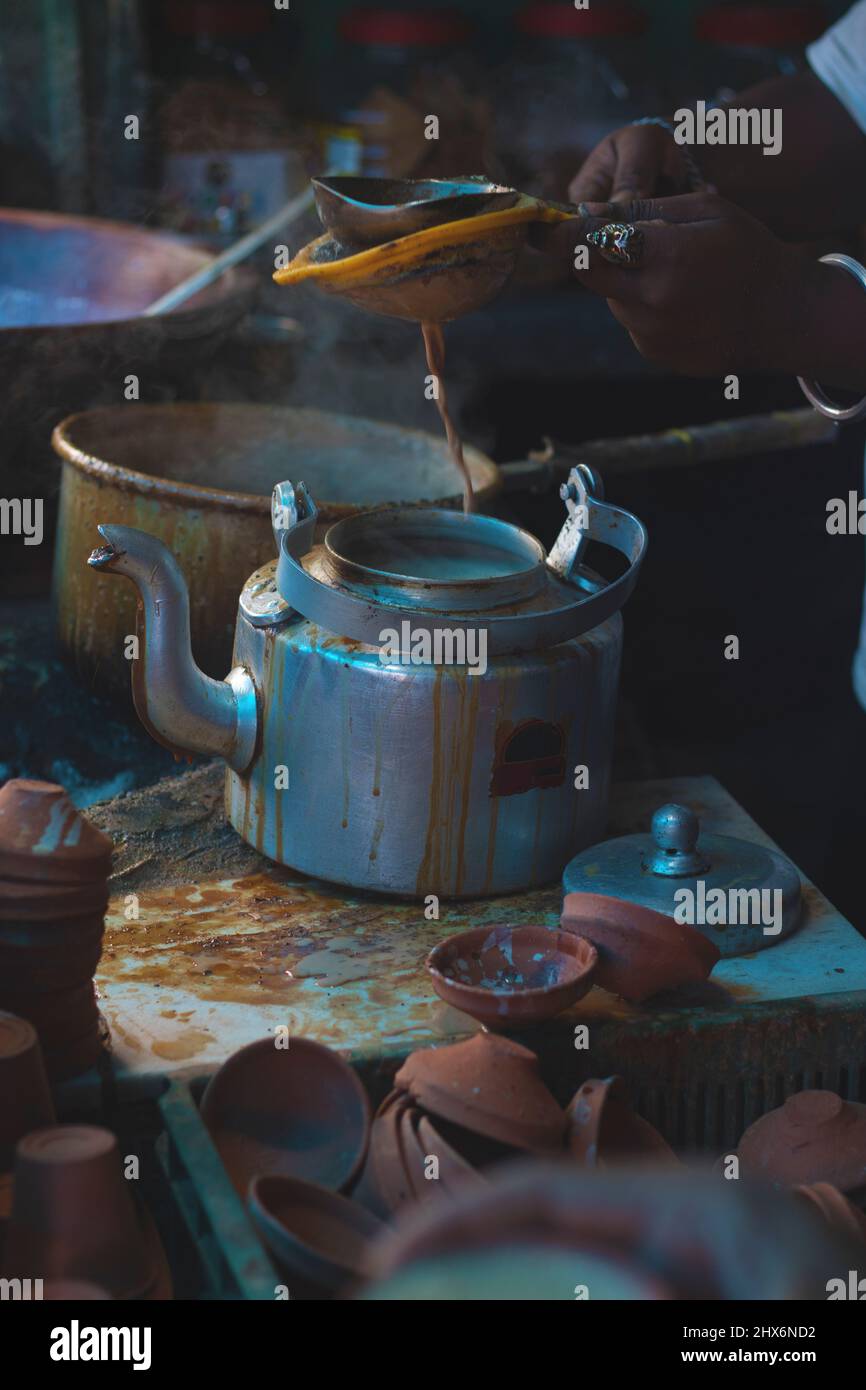Indian traditionally tea making process in a road side tea stall Stock ...