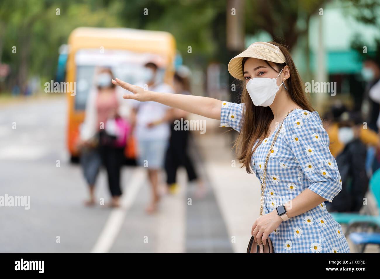 Chinese woman waiting bus stop hi-res stock photography and images - Alamy