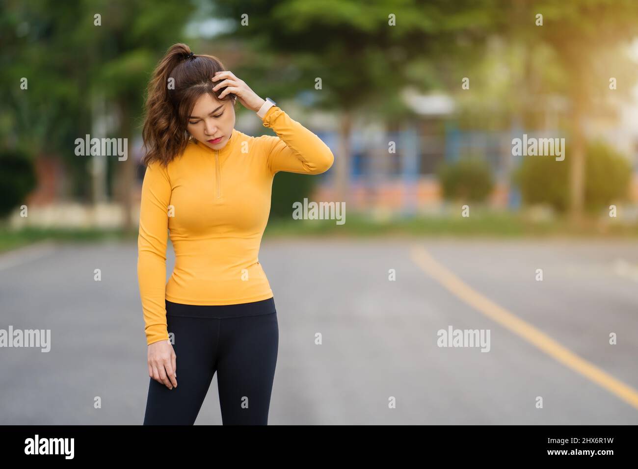 tired woman taking a rest after running or exercise in the park Stock ...