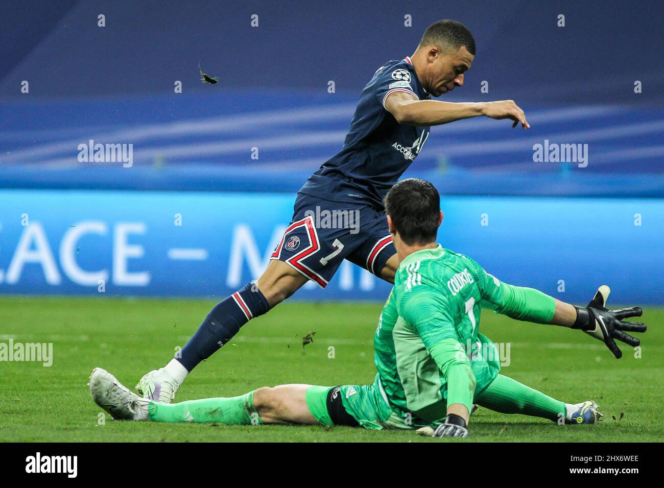 Kylian Mbappe of PSG and Thibaut Courtois of Real Madrid in action ...
