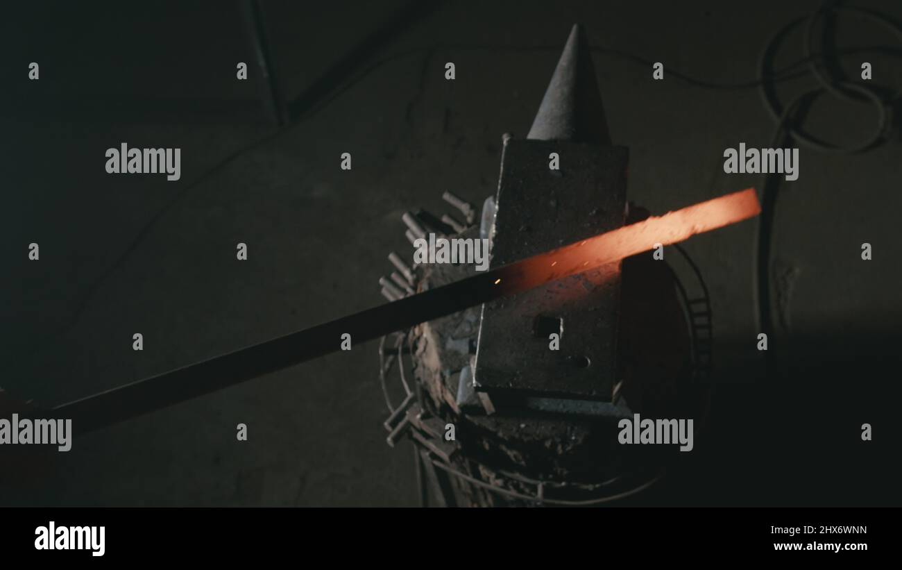 Forge workshop. Smithy manual production. Hands of smith with hammer ...